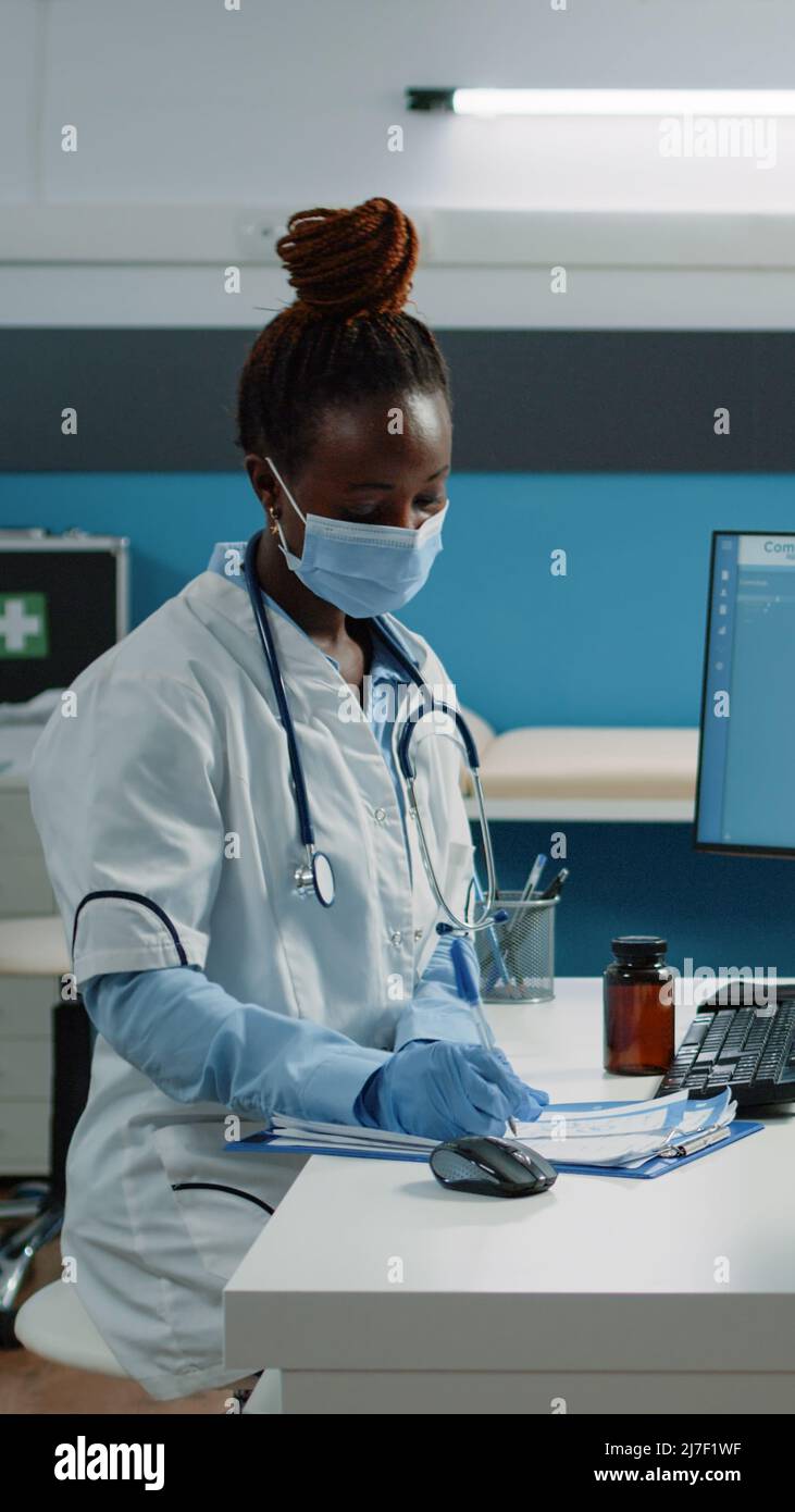 Doctor giving prescription medicine to patient against illness at ...