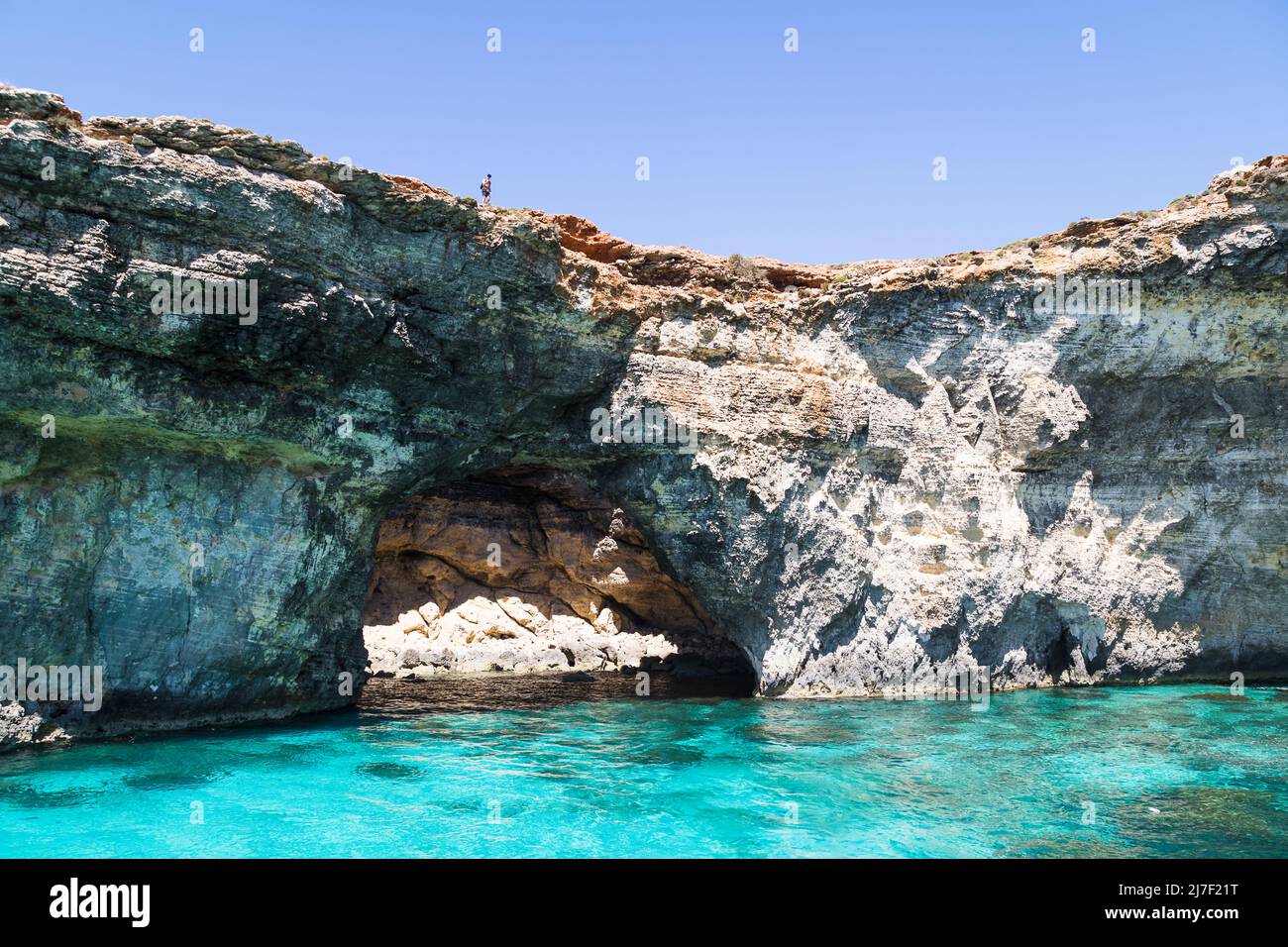 Crystal Lagoon cave seen from a boat next to the island of Comino in ...