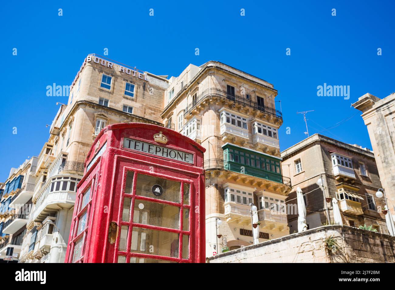 An old red telephone box in Valletta showing its ties with Britian ...