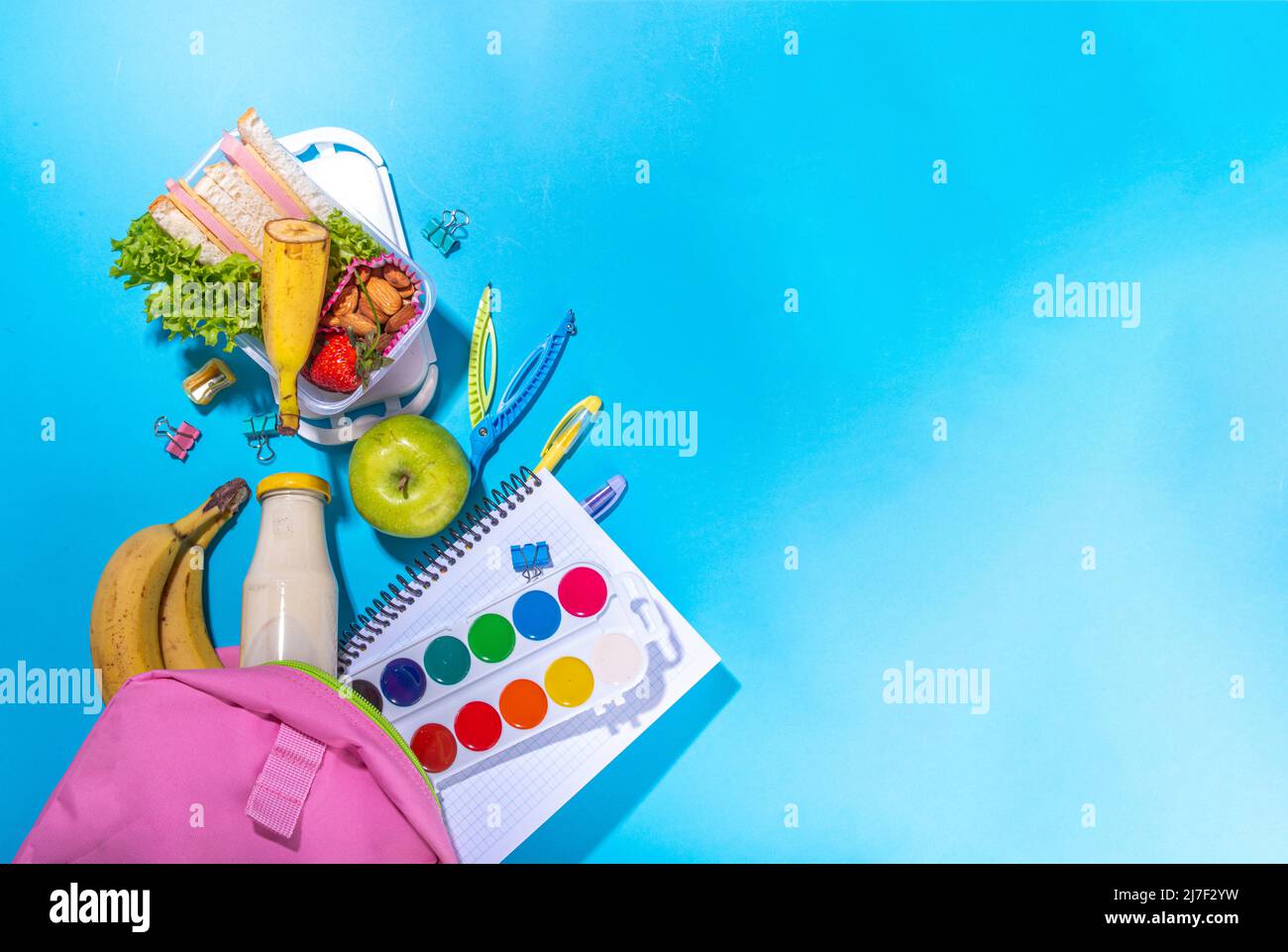 Healthy school lunch box: sandwich, vegetables, fruit, nuts and yogurt ...