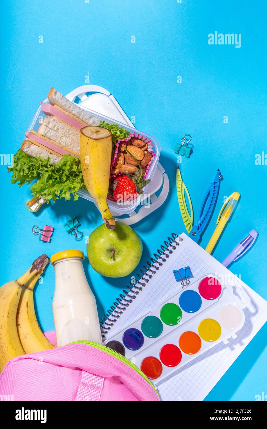 Healthy school lunch box: sandwich, vegetables, fruit, nuts and yogurt ...