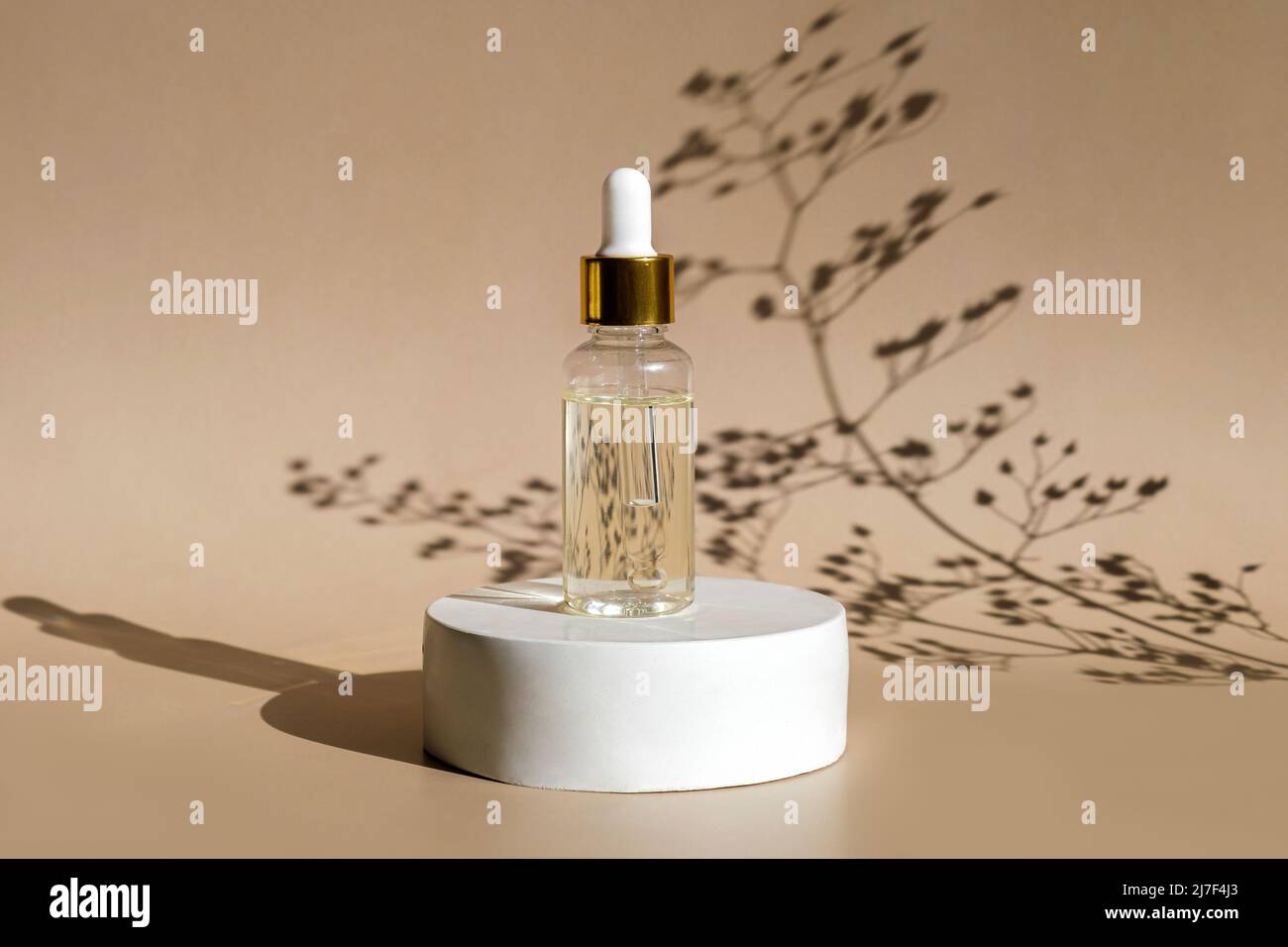 Natural oil cosmetics on wooden pedestal. Blank Dropper glass Bottle ...