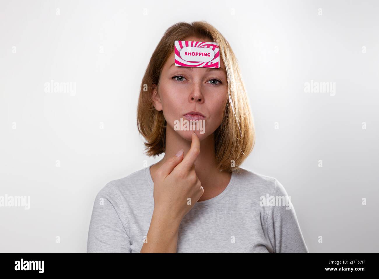 Finance and banking. Portrait of a young blonde who has a Bank card ...