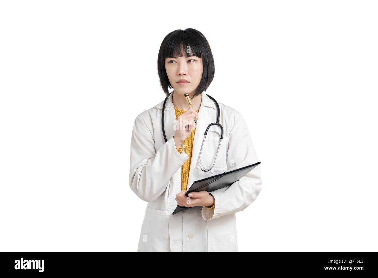 Young asian female doctor thinking with pen and folder, isolated Stock ...