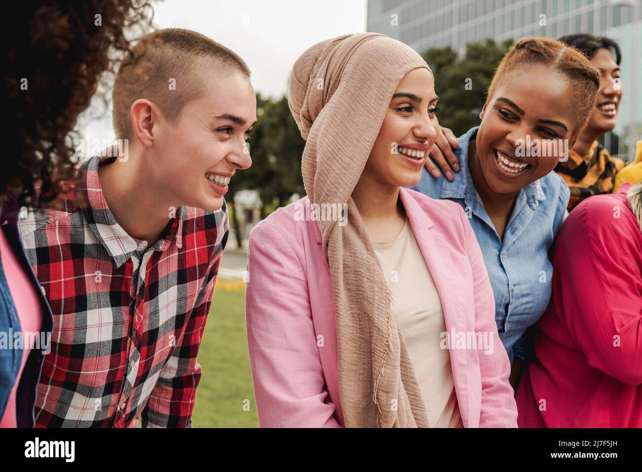 Multiracial group of young people having fun outdoor - Focus on Muslim ...