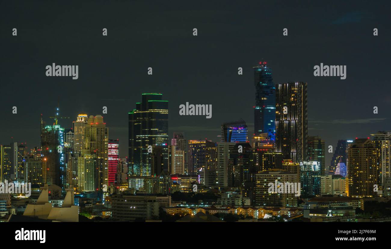 Modern buildings in downtown city at night Stock Photo - Alamy