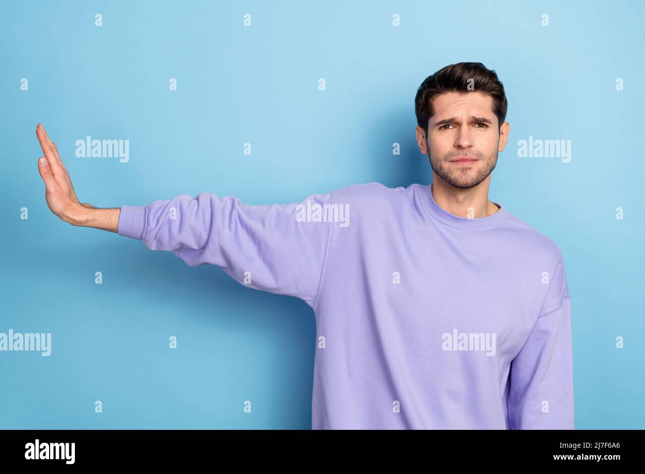 Photo of unhappy millennial brunet guy show no wear sweater isolated on ...