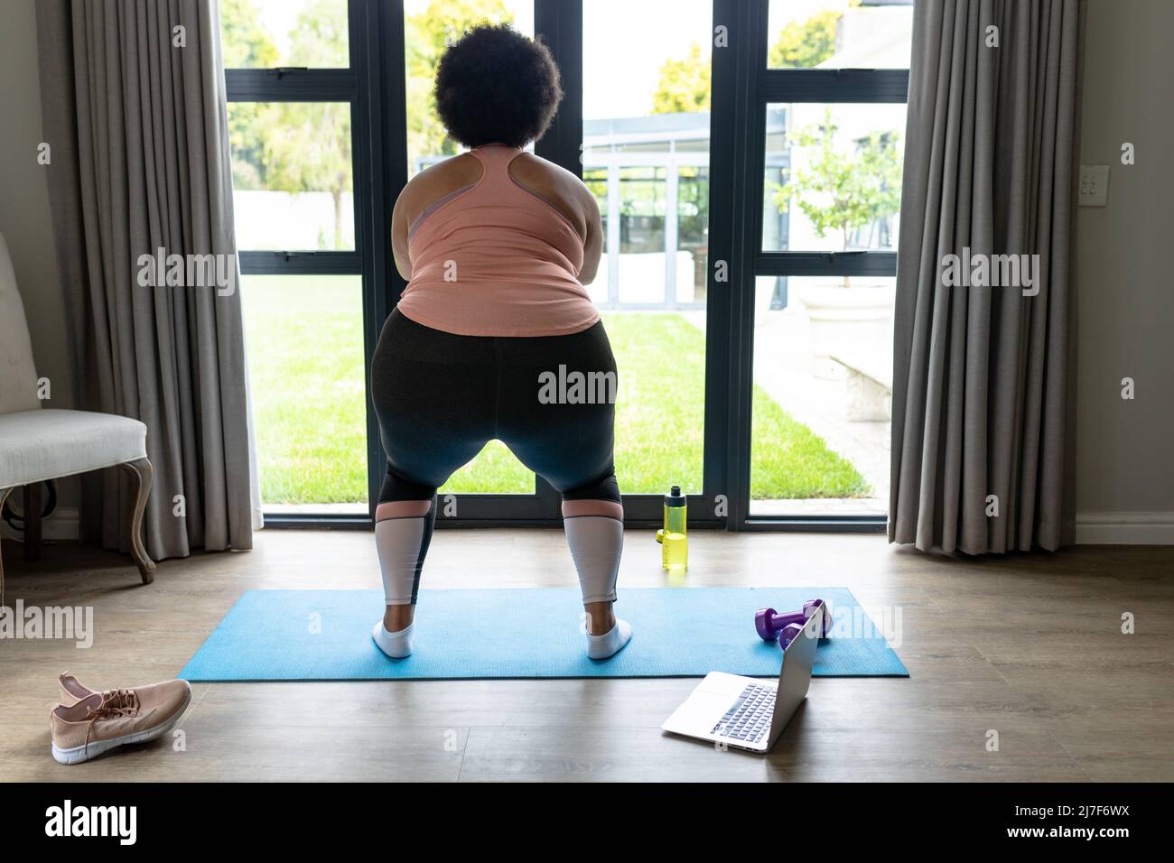 Woman squat pose hi-res stock photography and images - Alamy