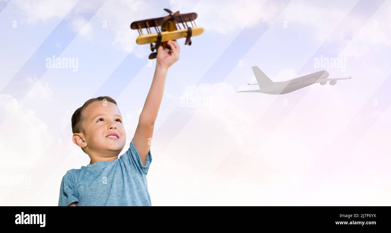 Multiple image of smiling caucasian boy flying toy airplane and ...