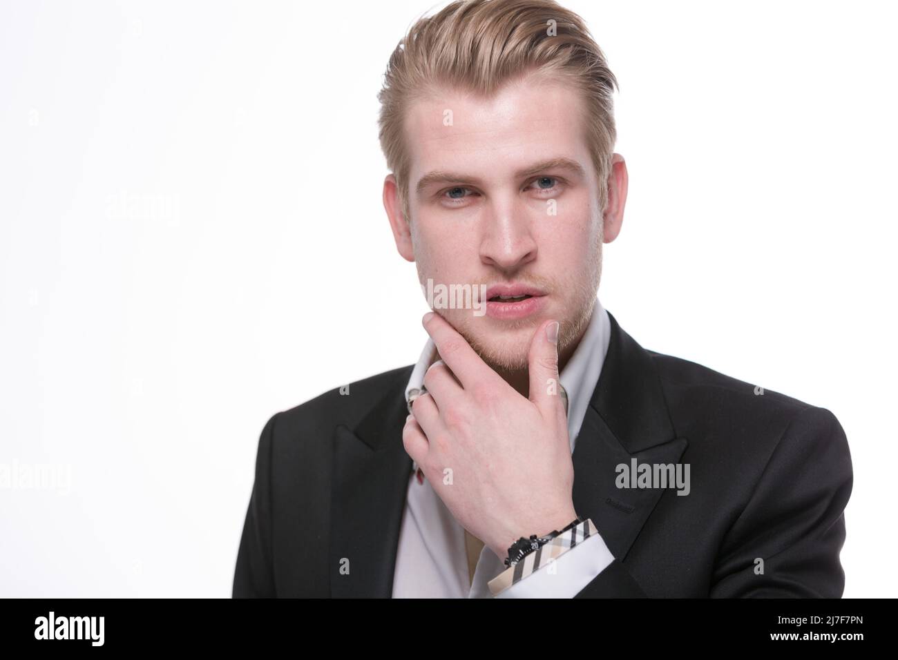 portrait of a young seriously looking business man Stock Photo - Alamy