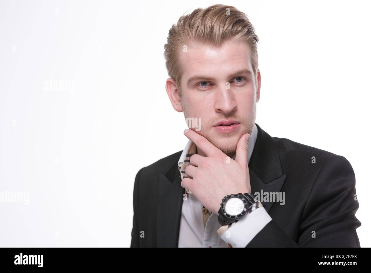 portrait of a young seriously looking business man Stock Photo - Alamy