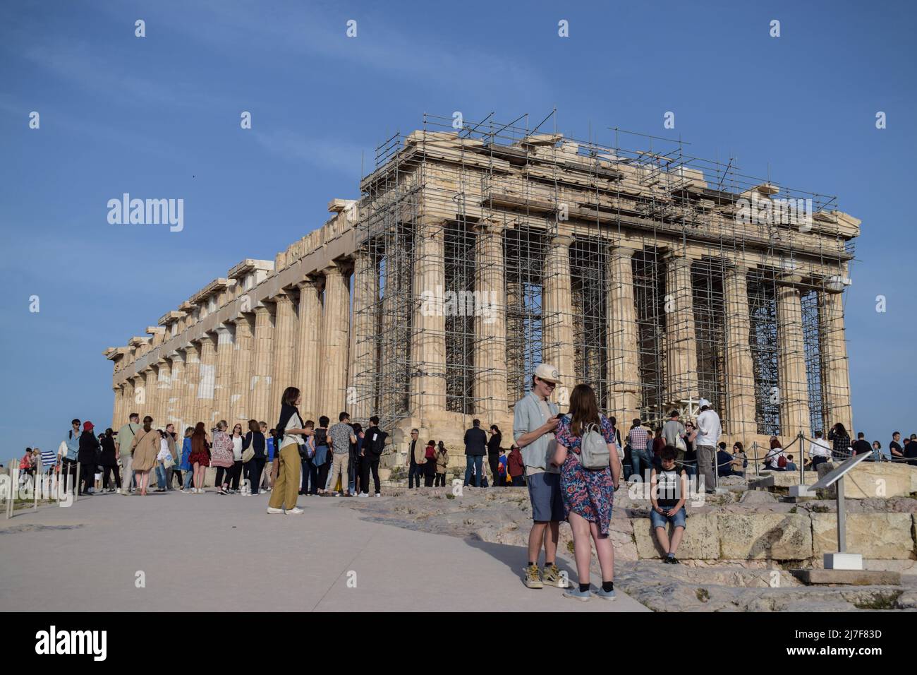 Tourists visit the Parthenon at the Athens' Acropolis archaeological site following the ease of ...