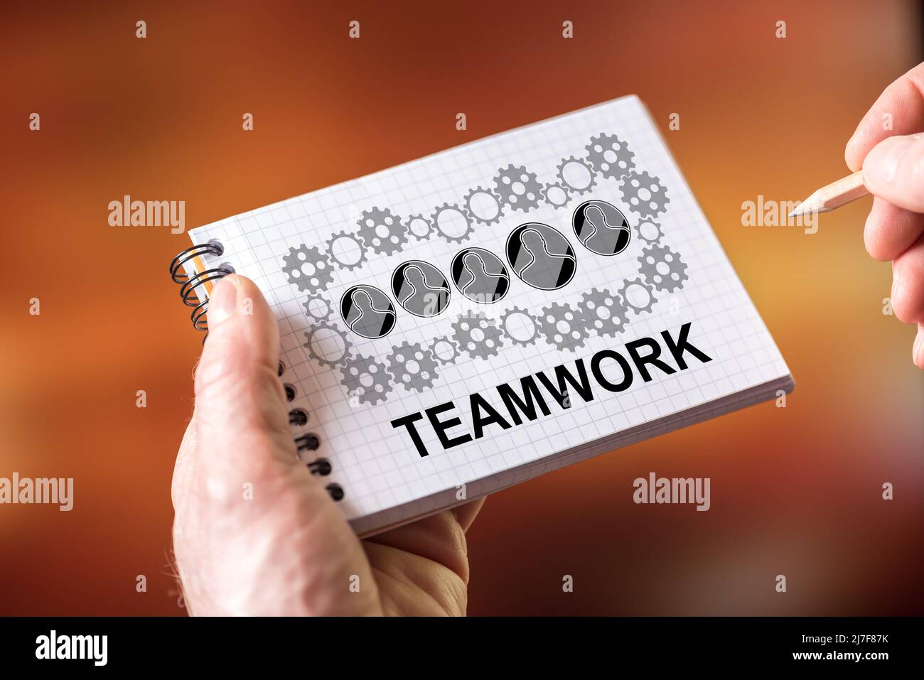 Hand drawing teamwork concept on a notepad Stock Photo - Alamy