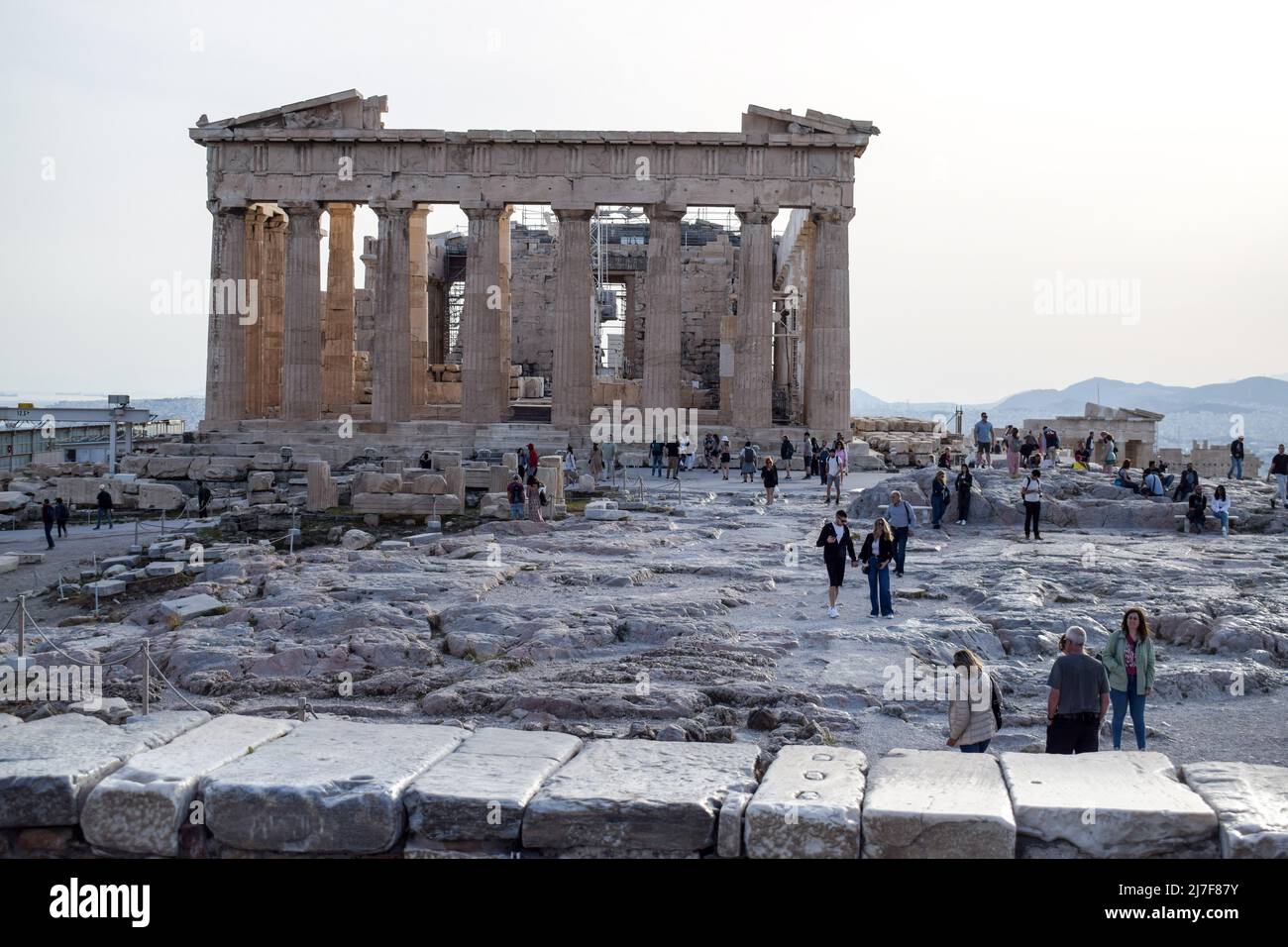 Tourists visit the Parthenon at the Athens' Acropolis archaeological site following the ease of ...