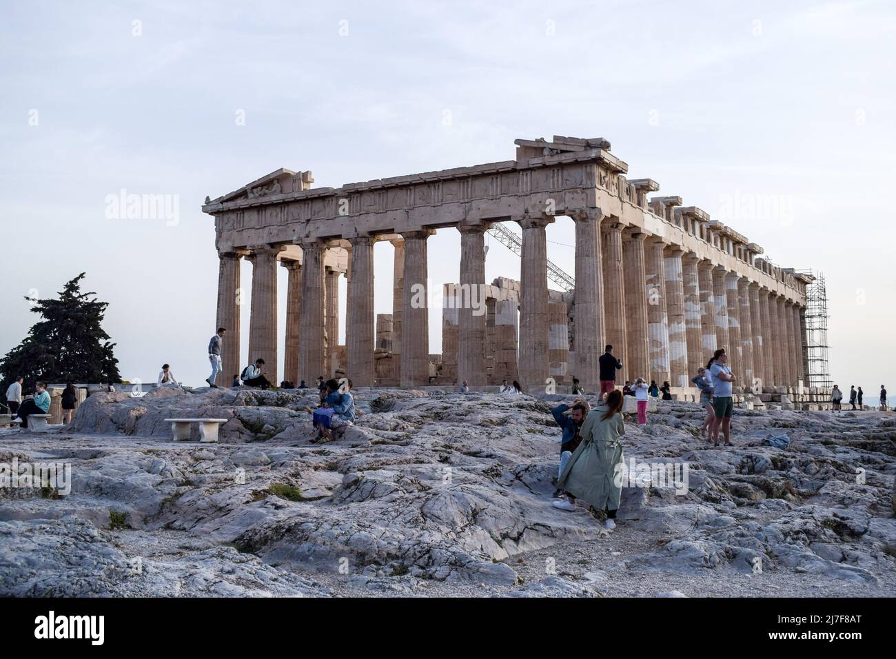 Tourists visit the Parthenon at the Athens' Acropolis archaeological site following the ease of ...