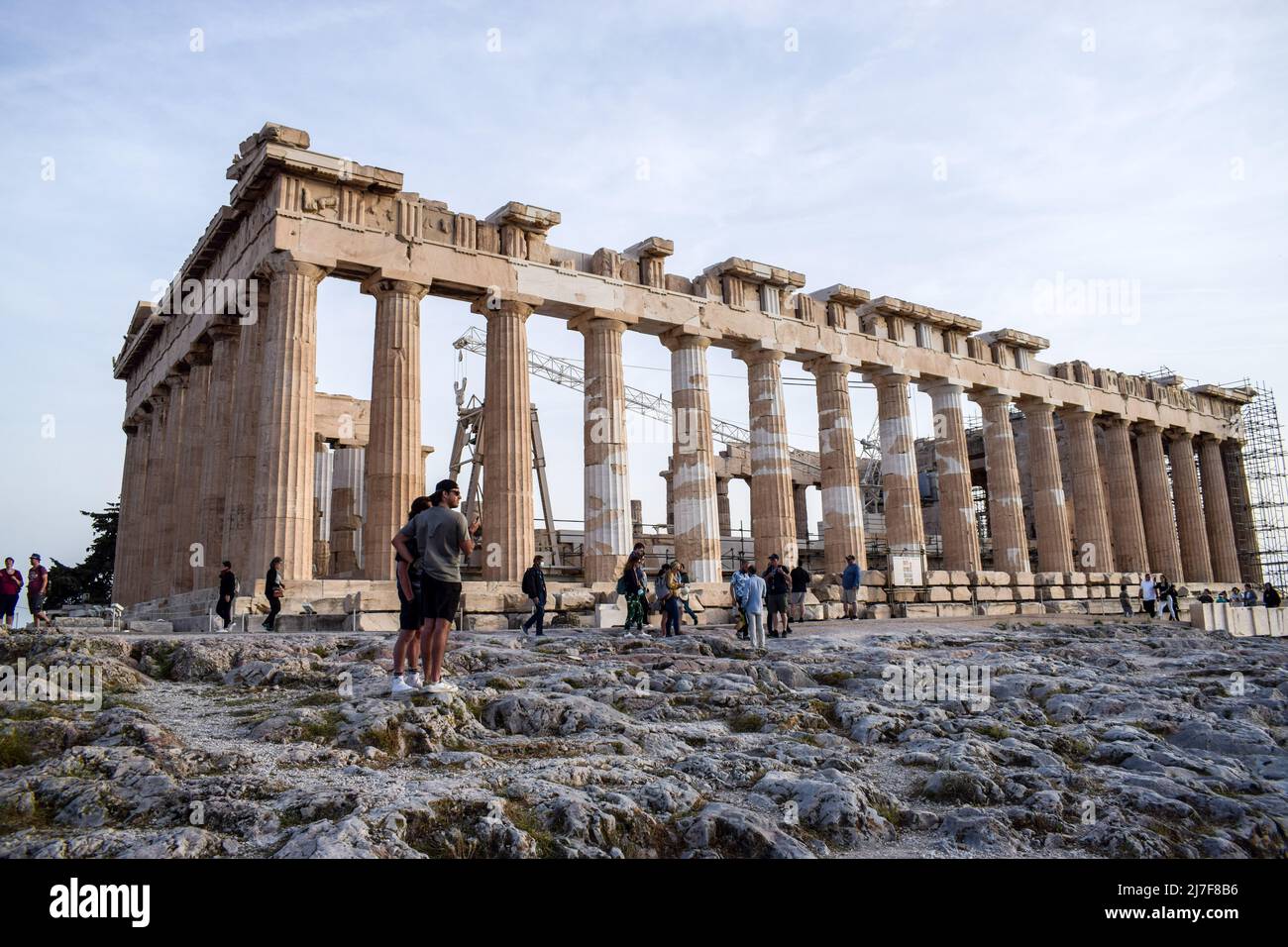 Tourists visit the Parthenon at the Athens' Acropolis archaeological site following the ease of ...