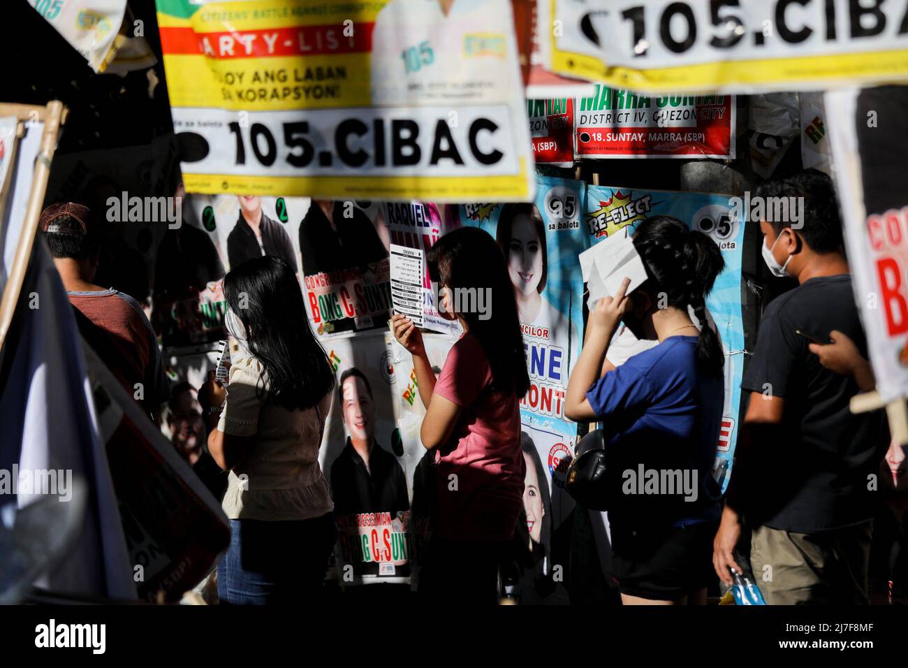 Manila, Philippines. 9th May, 2022. People queue to vote outside a ...