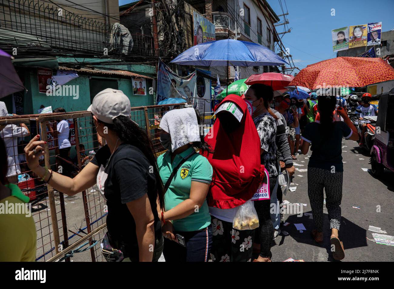 Manila, Philippines. 9th May, 2022. People queue to vote outside a ...