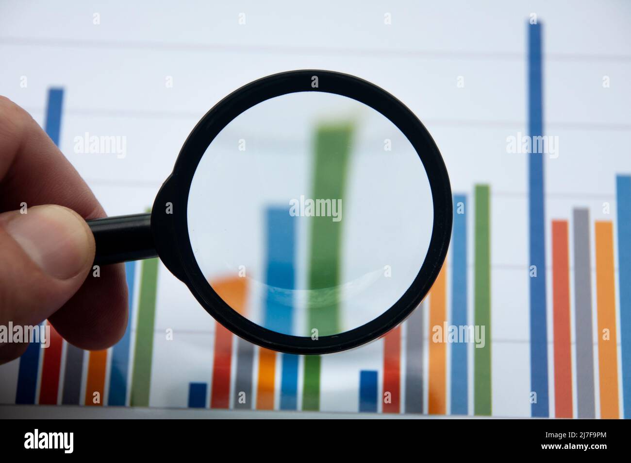 Analysis of data, chart and graphs using magnifying glass. Business ...
