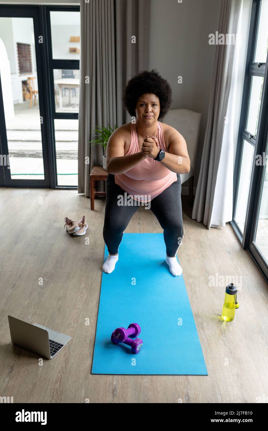Woman squats yoga hi-res stock photography and images - Alamy
