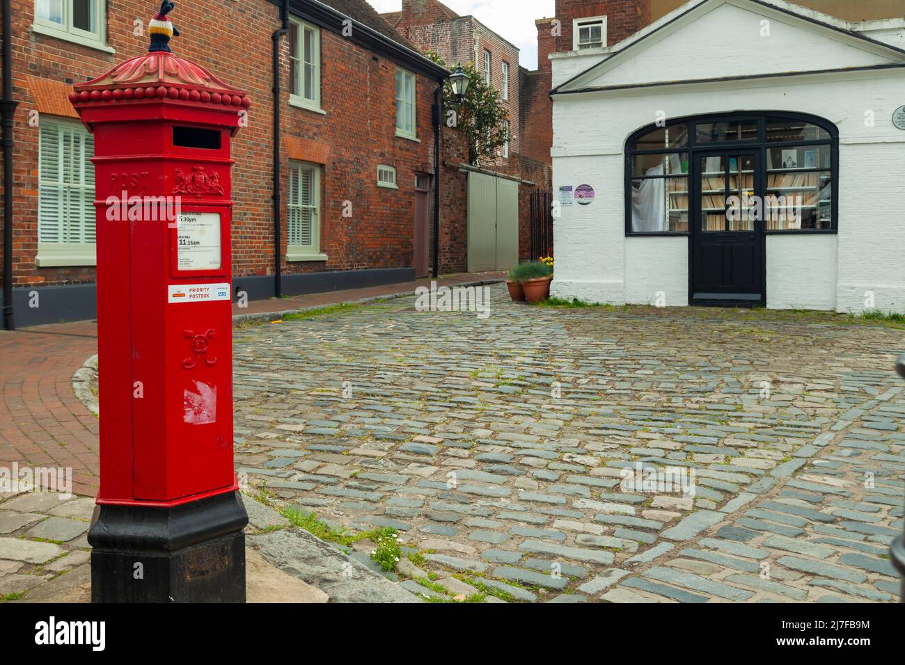 Traditional red mail box in Faversham town centre, Kent, England Stock ...