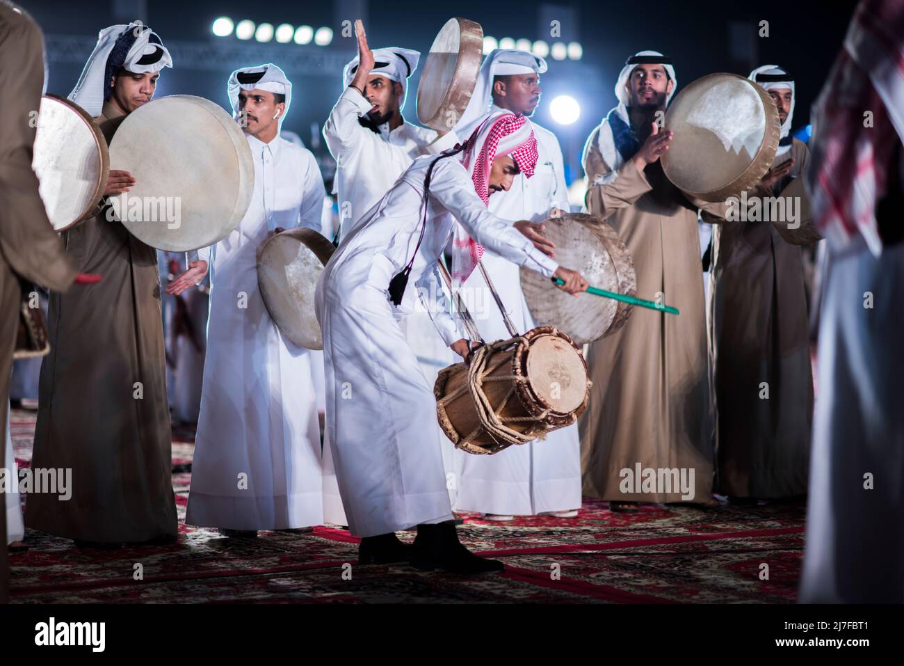 Doha, Qatar, December 18,2017: The drummers dressed in traditional ...