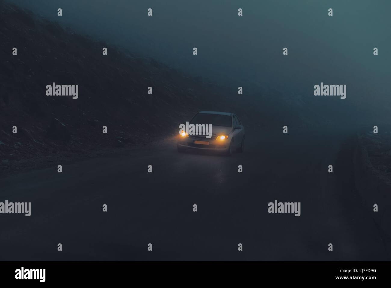 Car on the Night Misty Road Stock Photo - Alamy