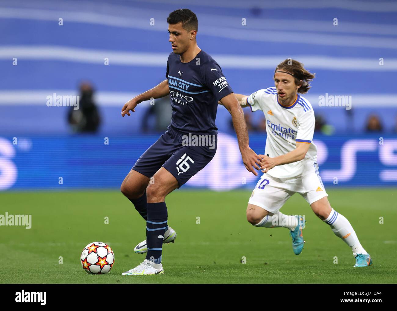 Madrid, Spain, 4th May 2022. Rodrigo of Manchester City is pursued by ...