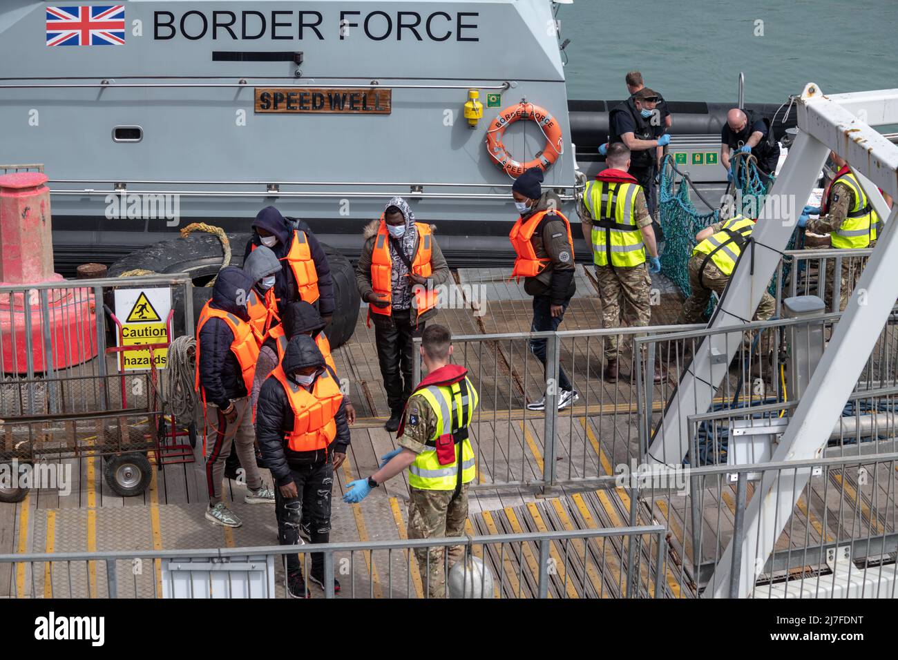 Border Force and the Royal Navy bring migrants including women and ...