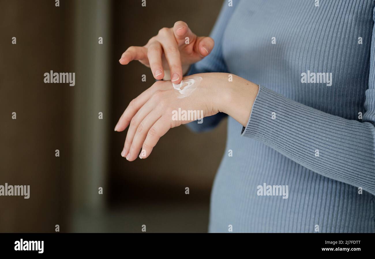 closeup view of woman hands applying cream. skin protection Stock Photo ...