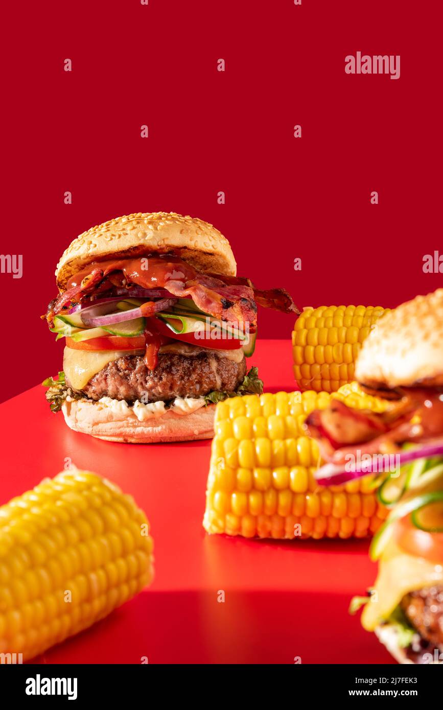 Bold fresh cheeseburger loaded with lettuce, cucumber, tomato, onion ...