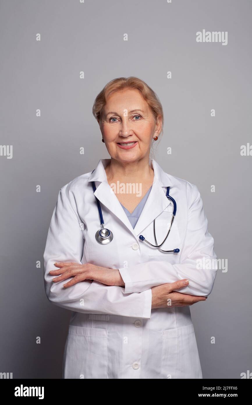 Smiling medical woman doctor. Cheerful happy doctor with crossed hands ...