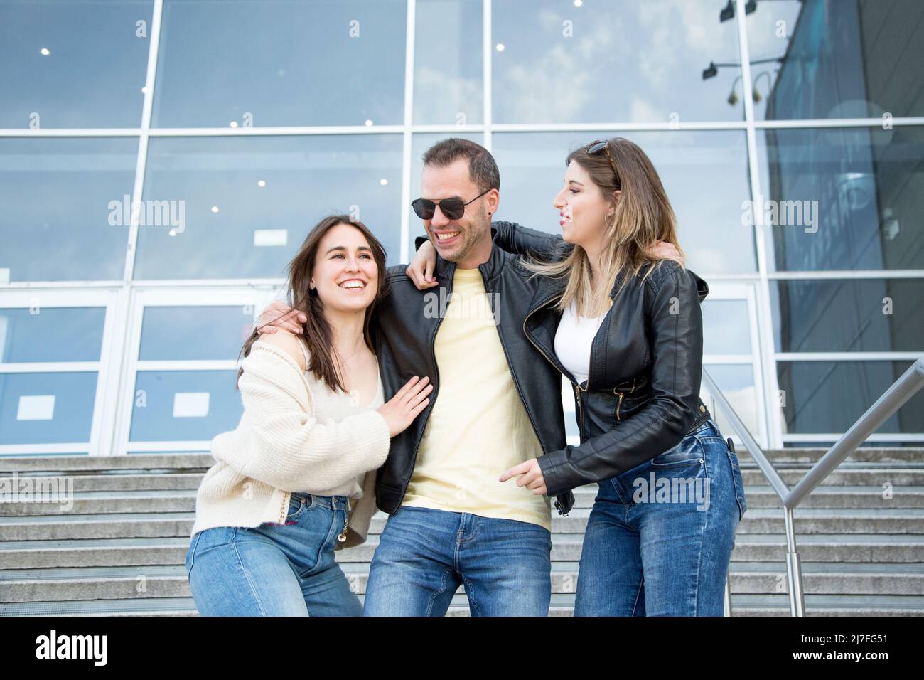three young friends having fun. real people concept friendship Stock ...