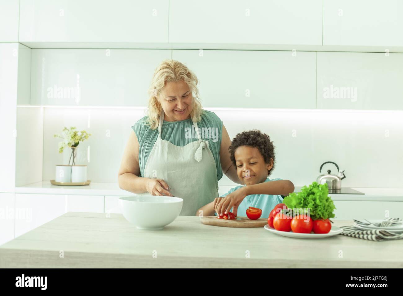 Mother with child cooking together Stock Photo - Alamy