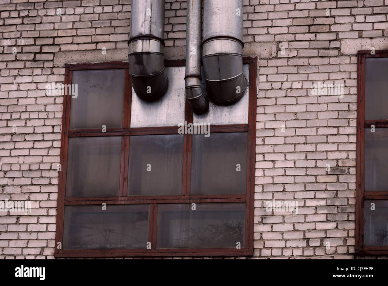 Industrial brick building with rusty pipes. Old factory Stock Photo - Alamy