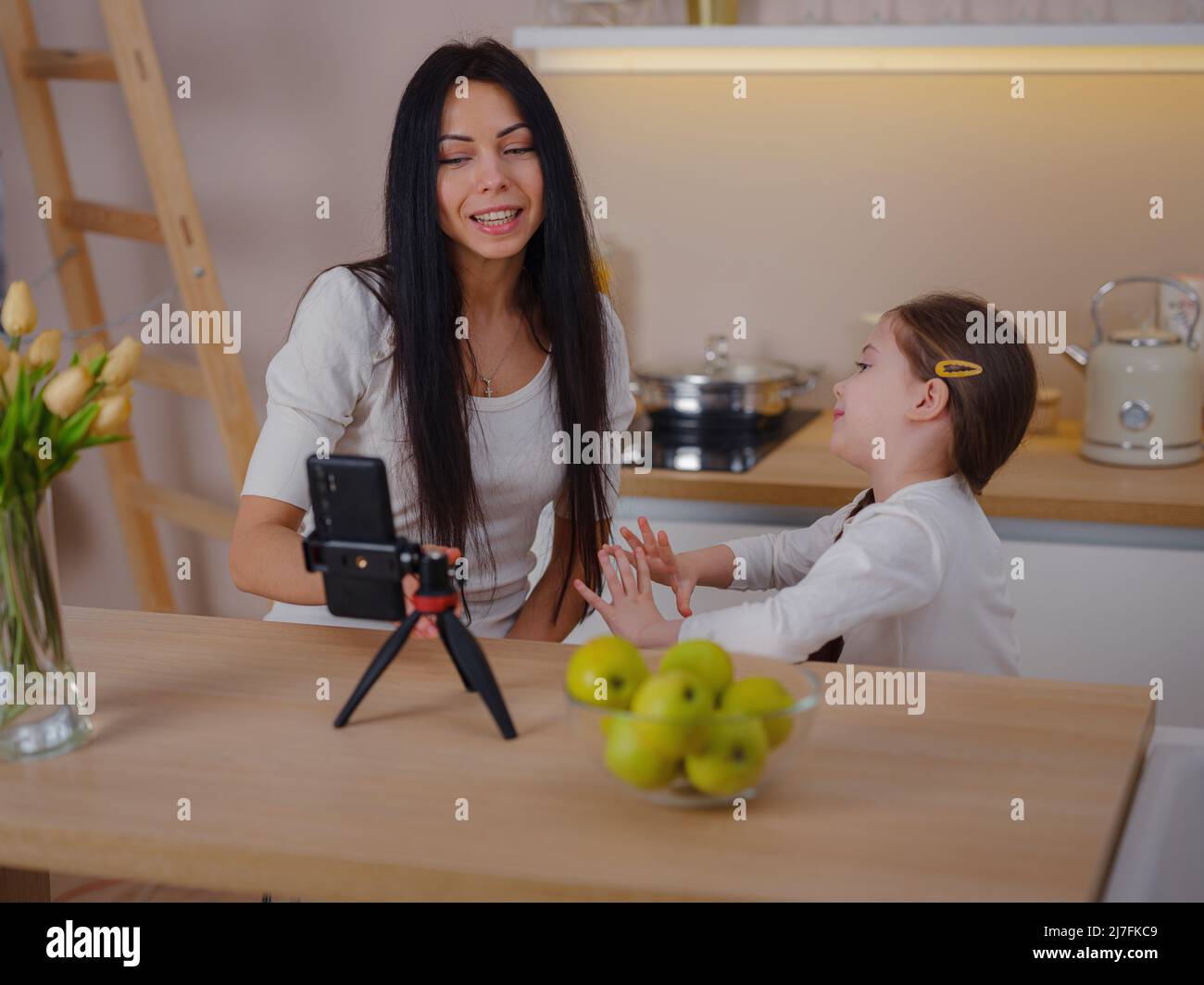 Blogger mom with her baby at home. Millennial Influencer woman creating ...