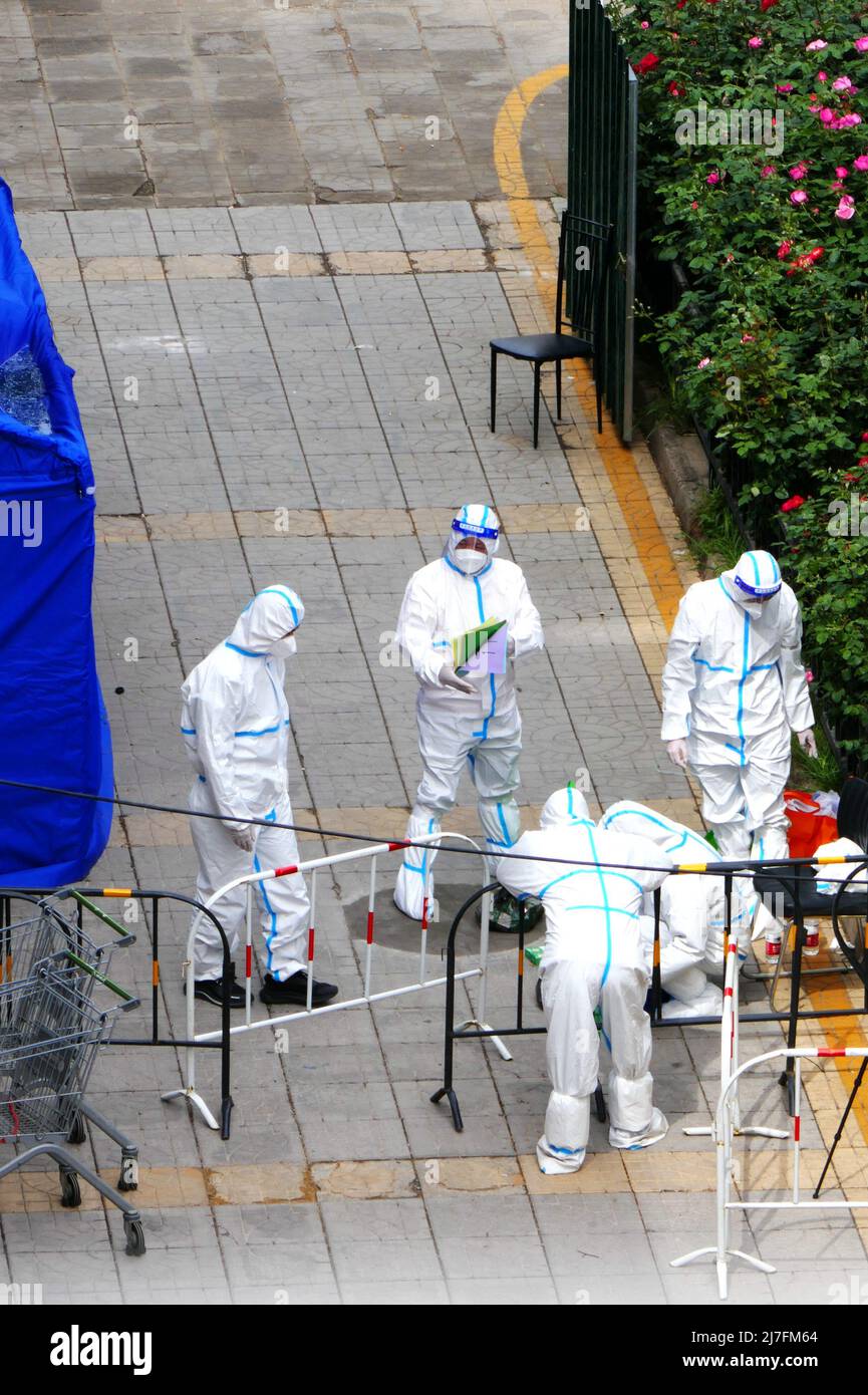 BEIJING, CHINA - MAY 9, 2022 - Volunteers work at a gated community in ...