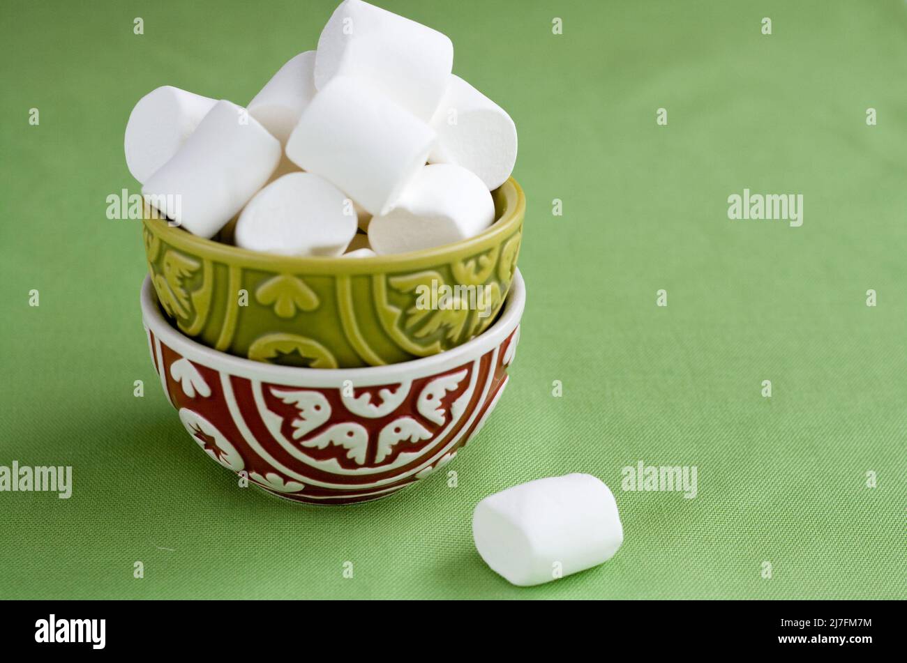 Sweet marshmallow is a traditional Turkish dish on a green background ...