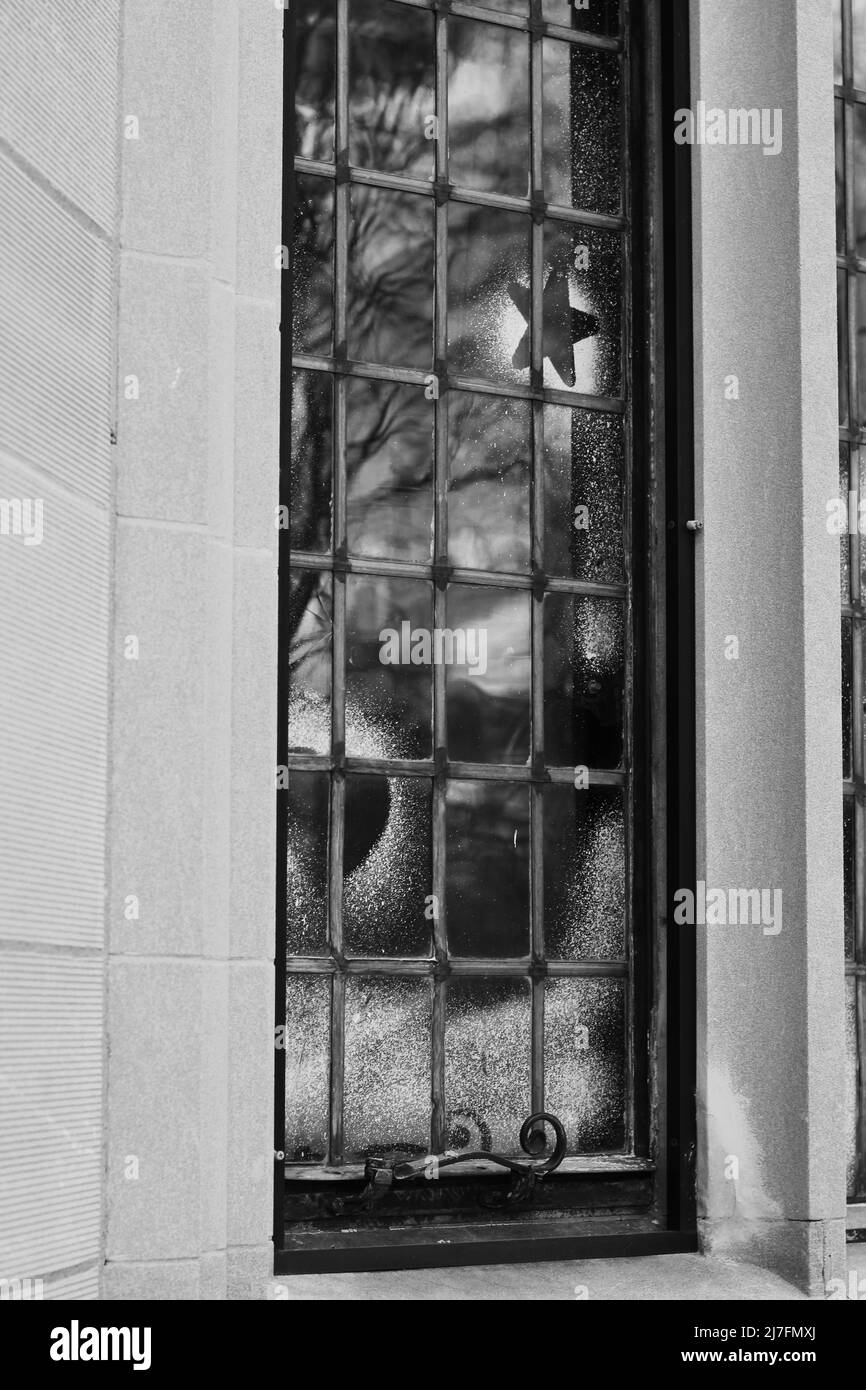 Medieval gothic windows with panes on a solid stone wall in black and ...