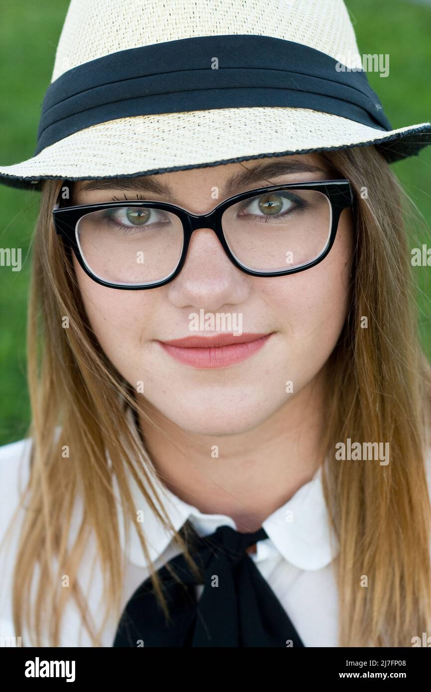 Pretty young teenage girl in dark glasses in the park Stock Photo - Alamy