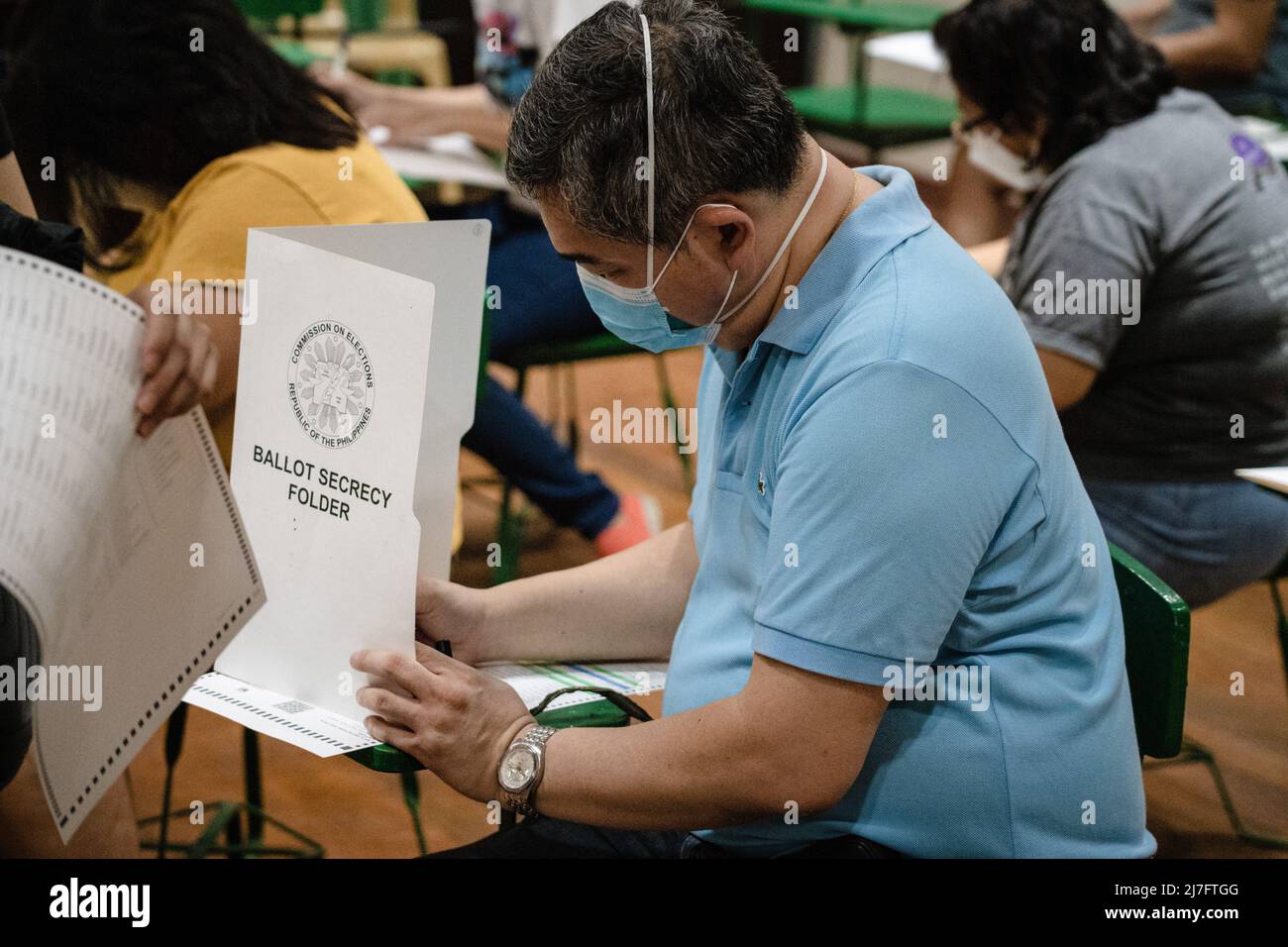 Manila, Philippines. 09th May, 2022. A voter casts his ballot at a ...