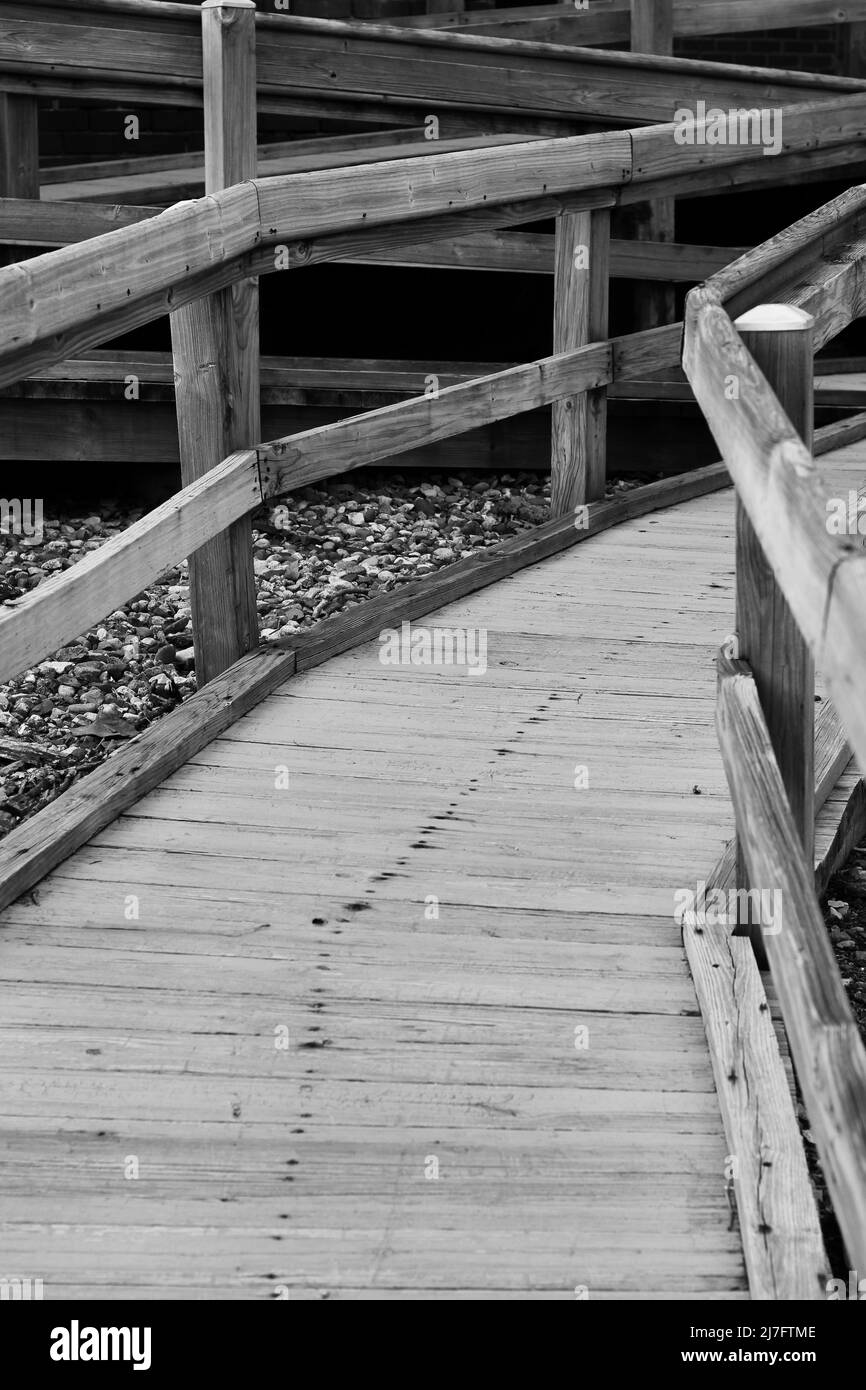 Wooden ramp curving to the side to form a path in black Stock Photo - Alamy