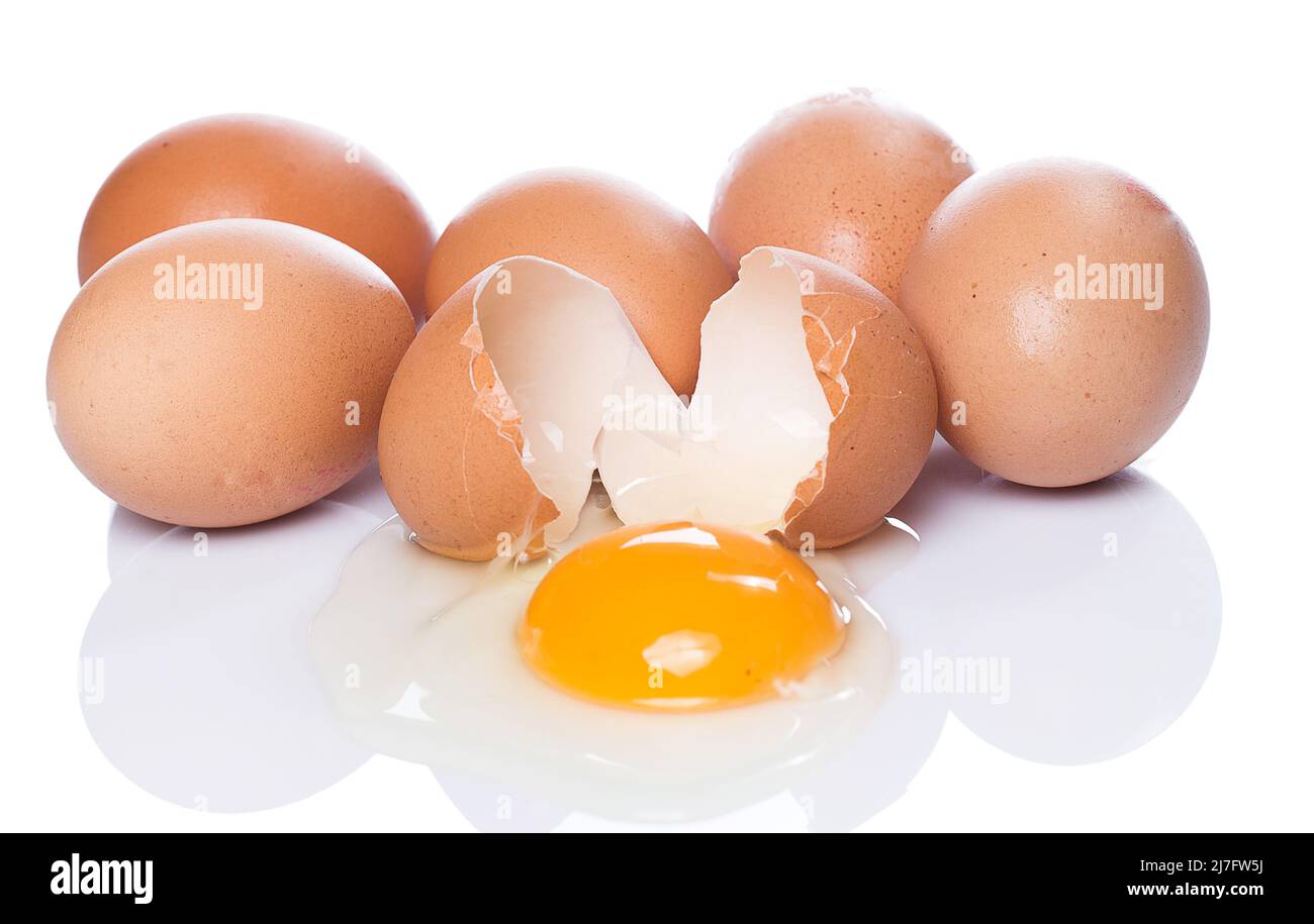 Closeup of cracked egg on white background Stock Photo - Alamy