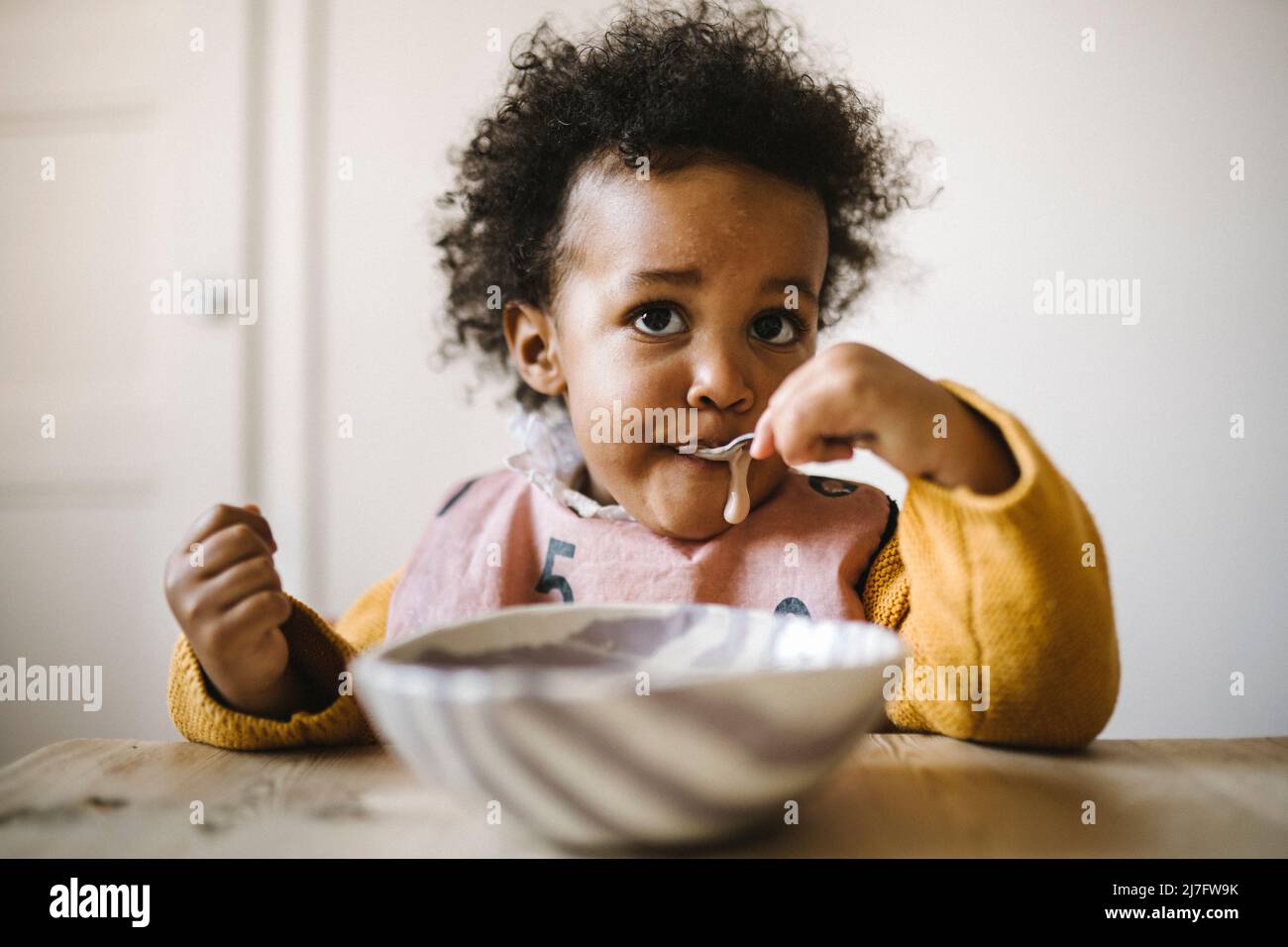 Girl with bowl hi-res stock photography and images - Alamy