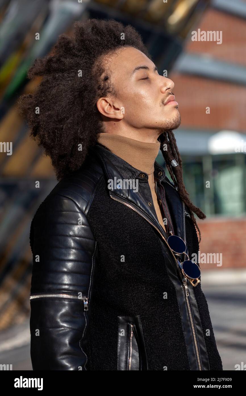 Young man with eyes shut Stock Photo - Alamy