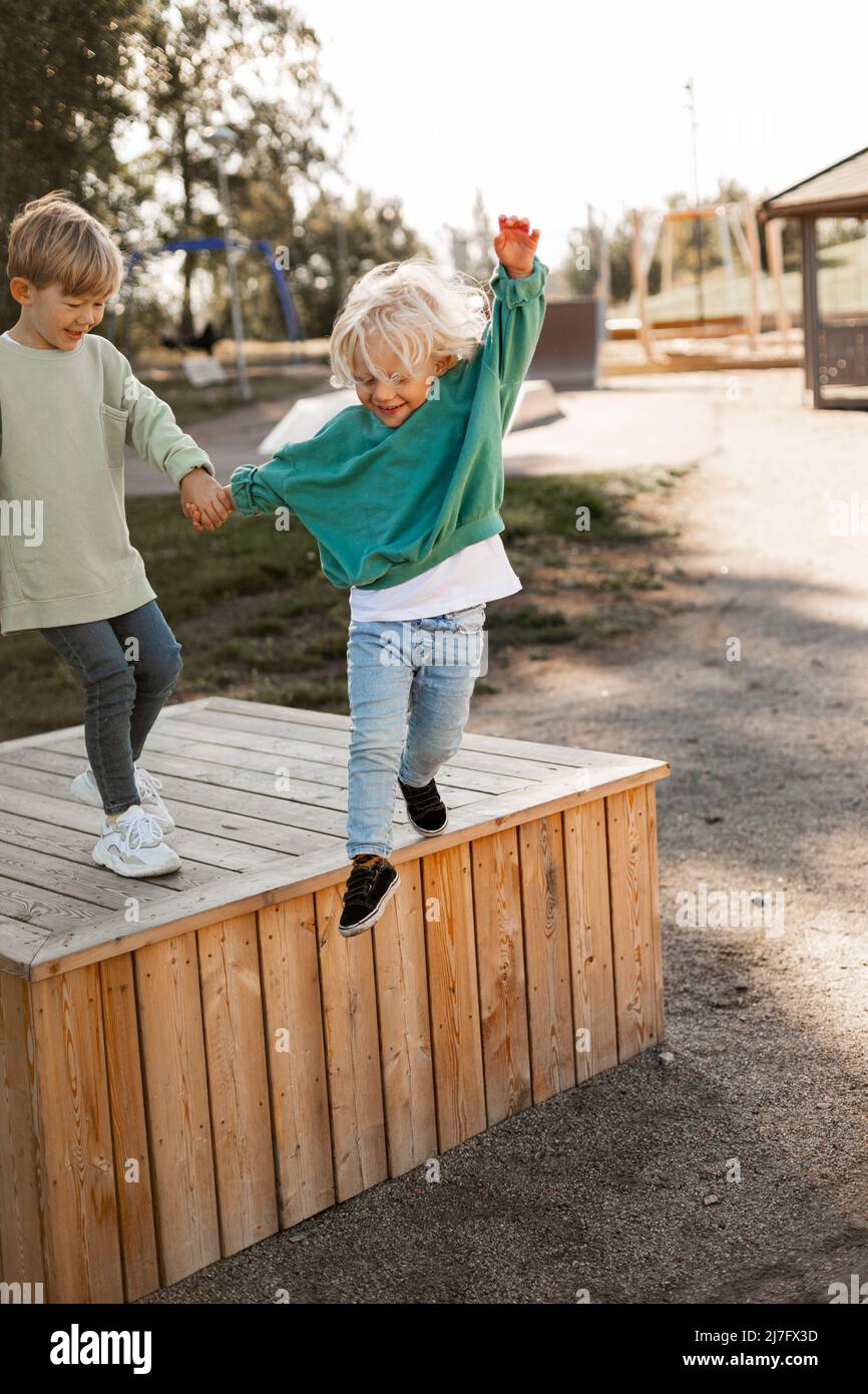 Children playing at playground Stock Photo - Alamy