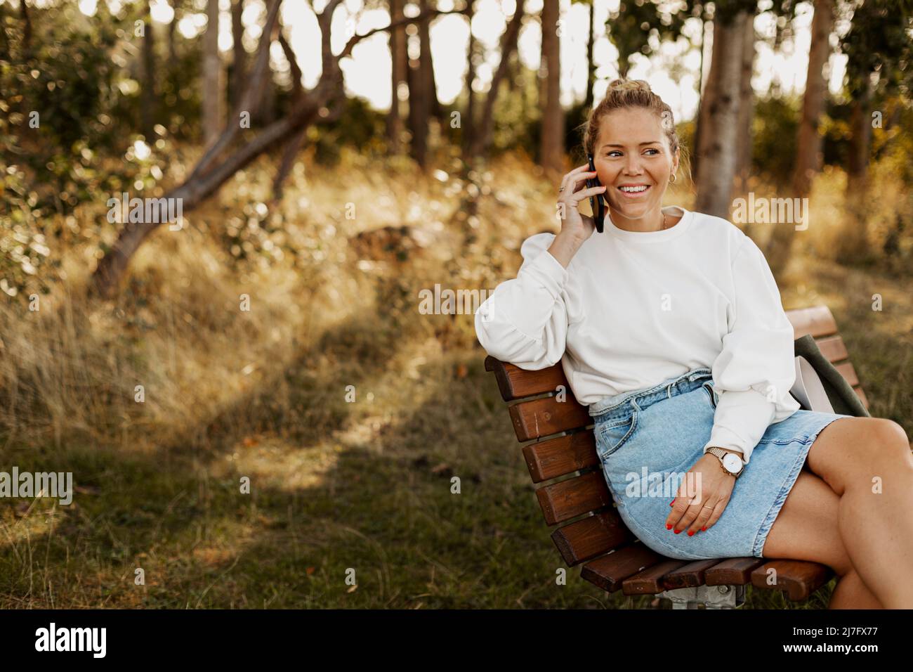 Smiling positive woman talking via hi-res stock photography and images ...