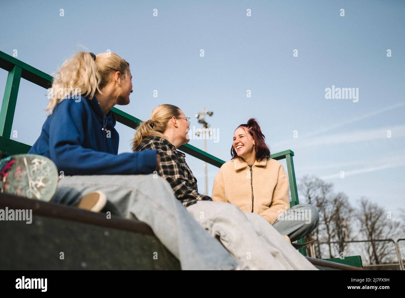 Happy friends sitting skatepark hi-res stock photography and images - Alamy