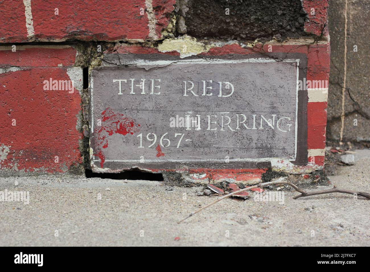 Cornerstone of a vintage brick building stating The Red Herring 1967 ...