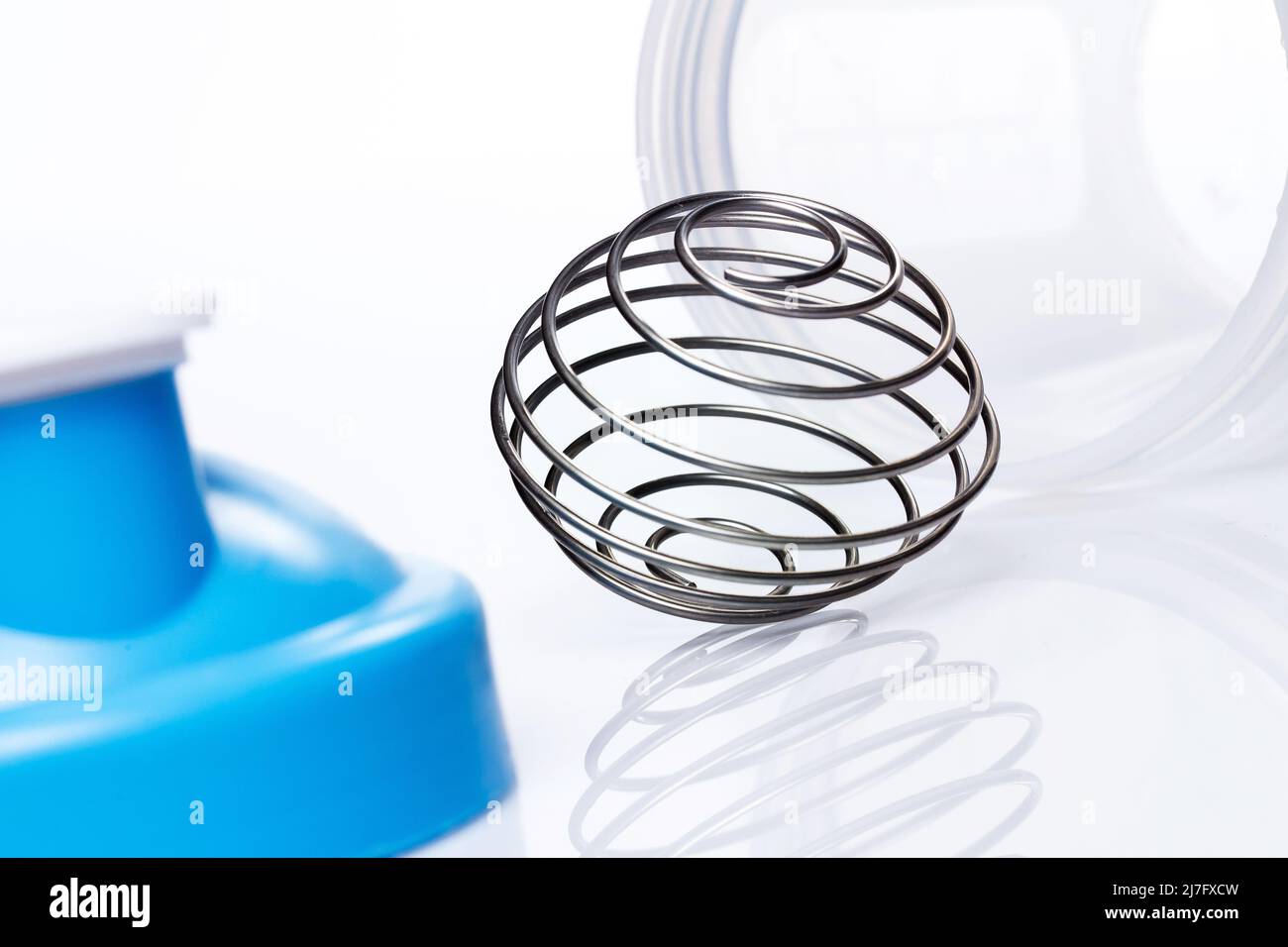 Protein shaker with metallic ball on white background Stock Photo - Alamy